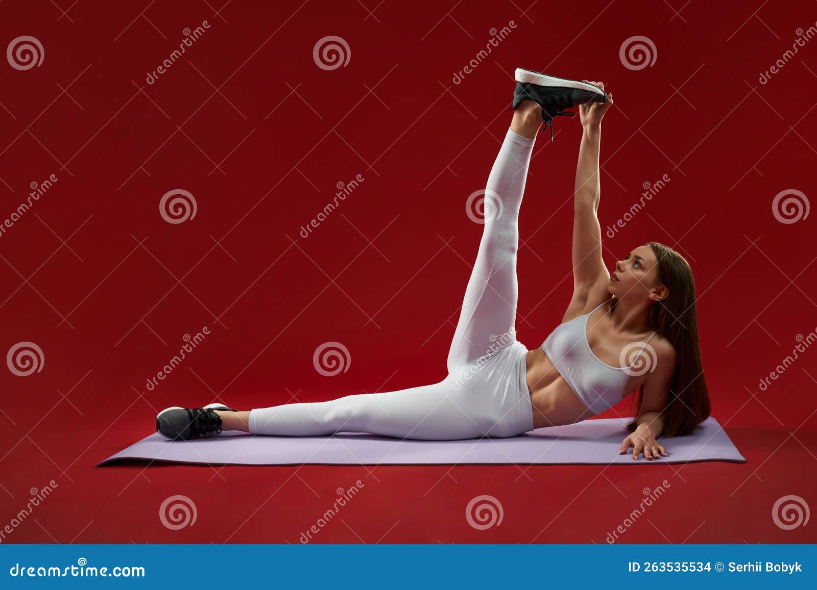 Pretty Flexibility Female Pull Sock on Herself Doing Stretching. Stock ...