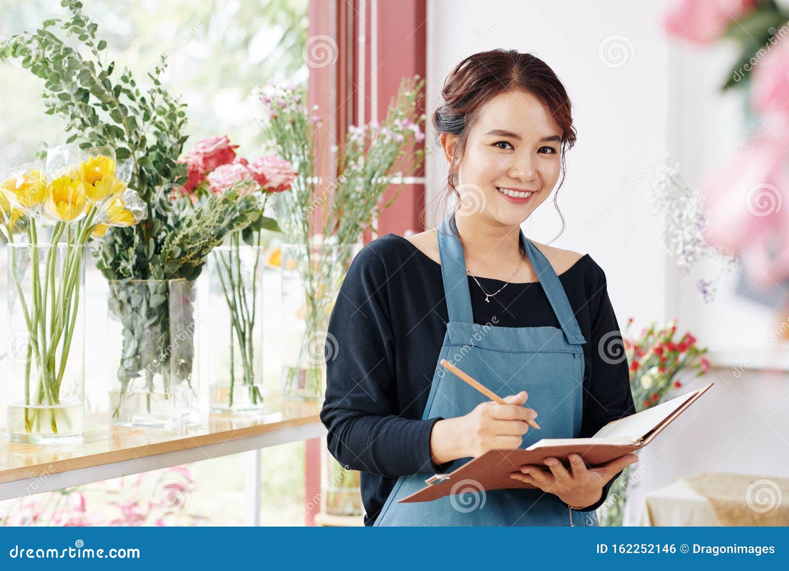 Pretty Florist with Planner Stock Photo - Image of business, florist ...