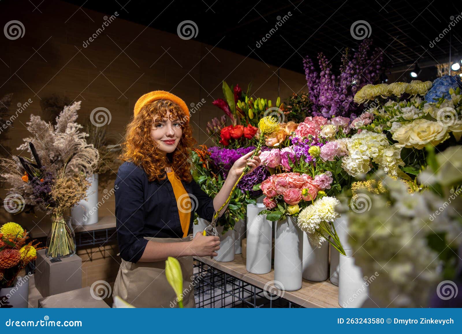 Pretty Florist Sorting the Flowers and Looking Involved Stock Photo ...