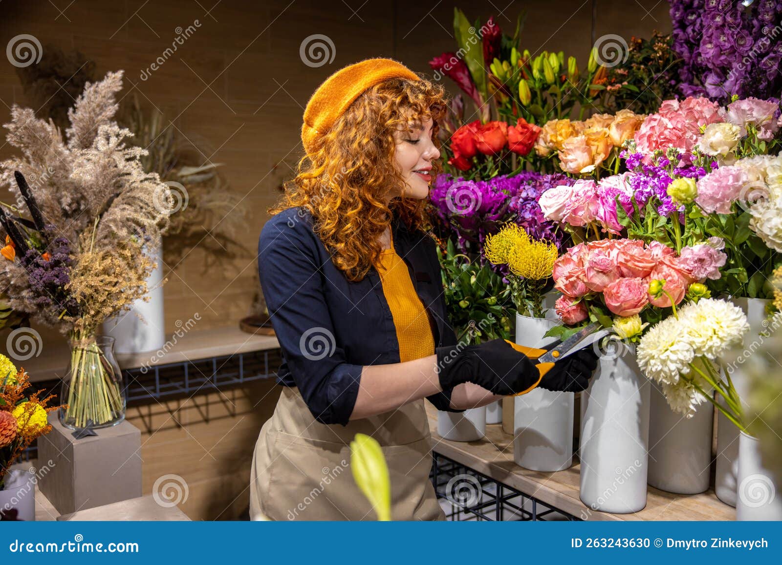 Pretty Florist Sorting the Flowers and Looking Involved Stock Photo ...