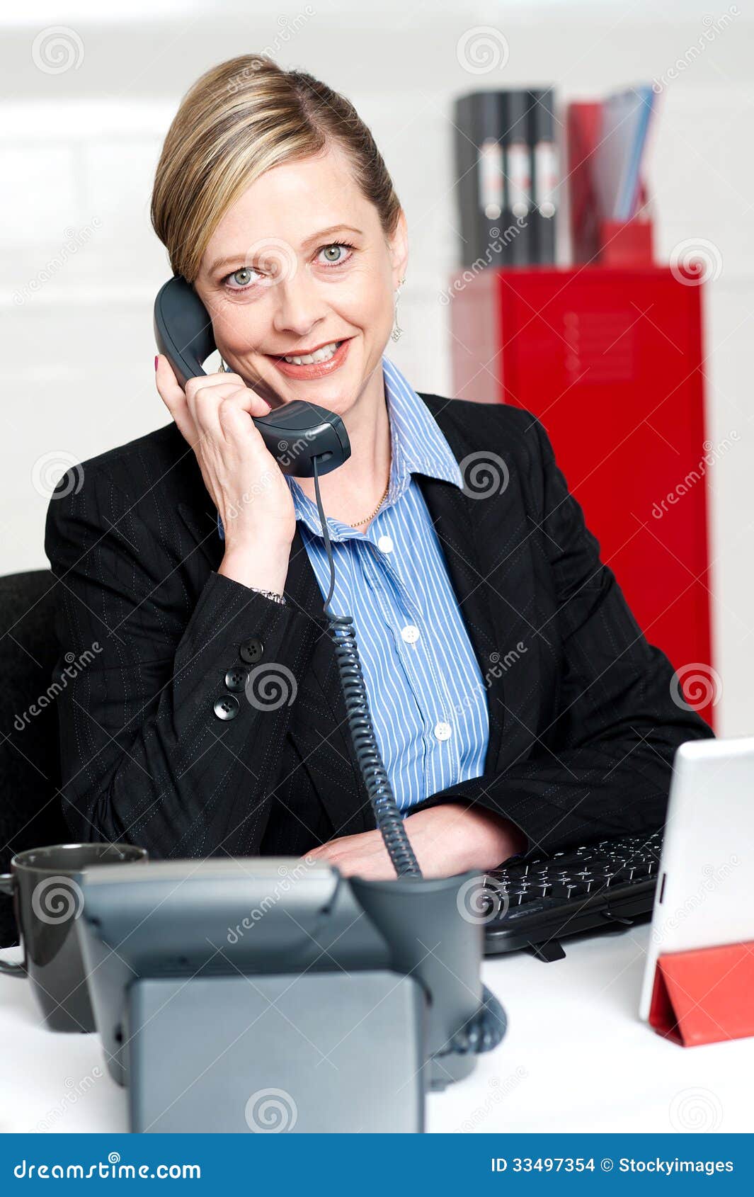 Pretty Front Desk Lady Attending Clients Call Stock Photo - Image of ...