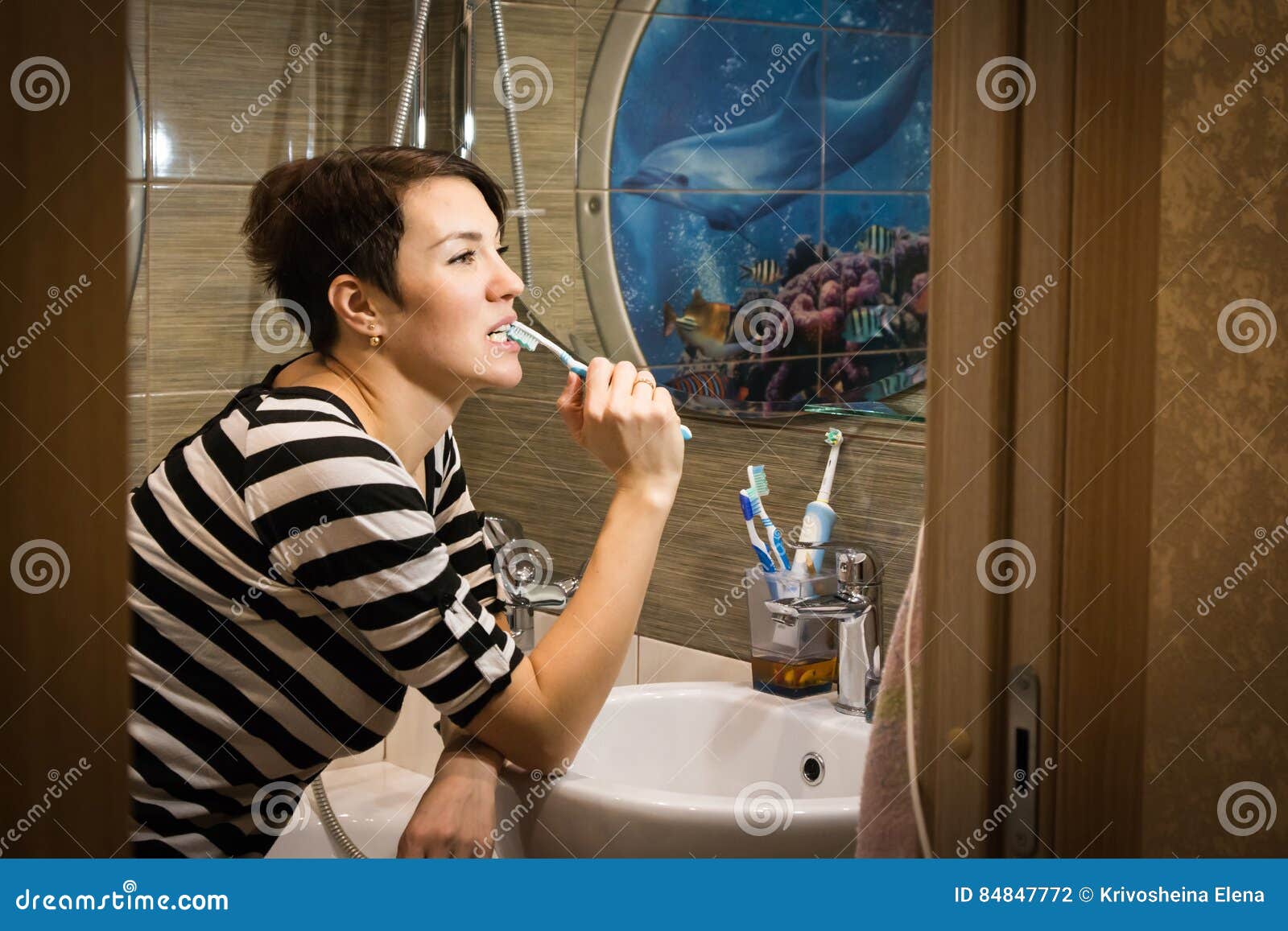 Pretty Girl Cleans Teeth in a Bathroom Stock Photo - Image of white ...