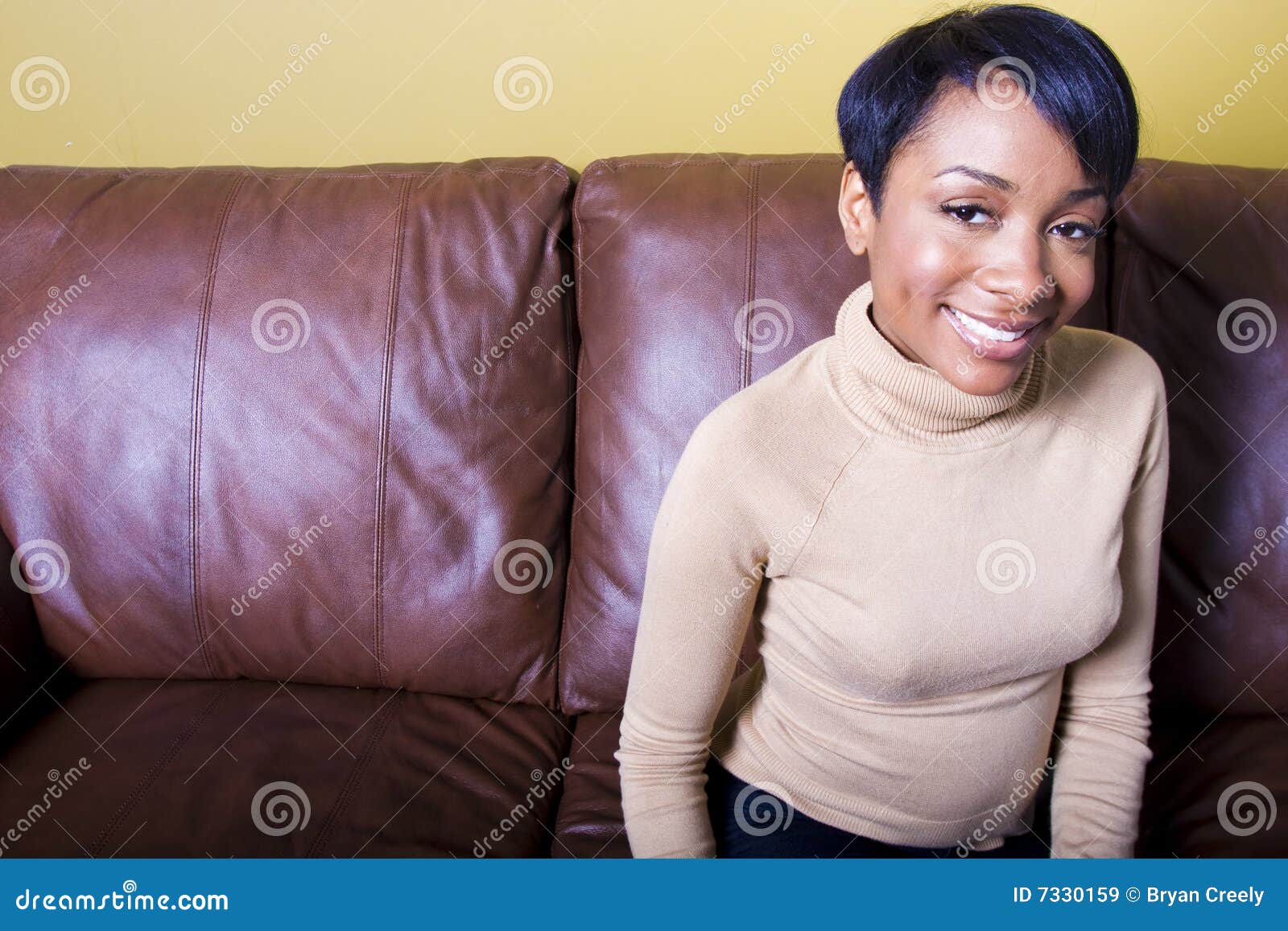 Pretty girl on a couch stock image. Image of person, sweater - 7330159