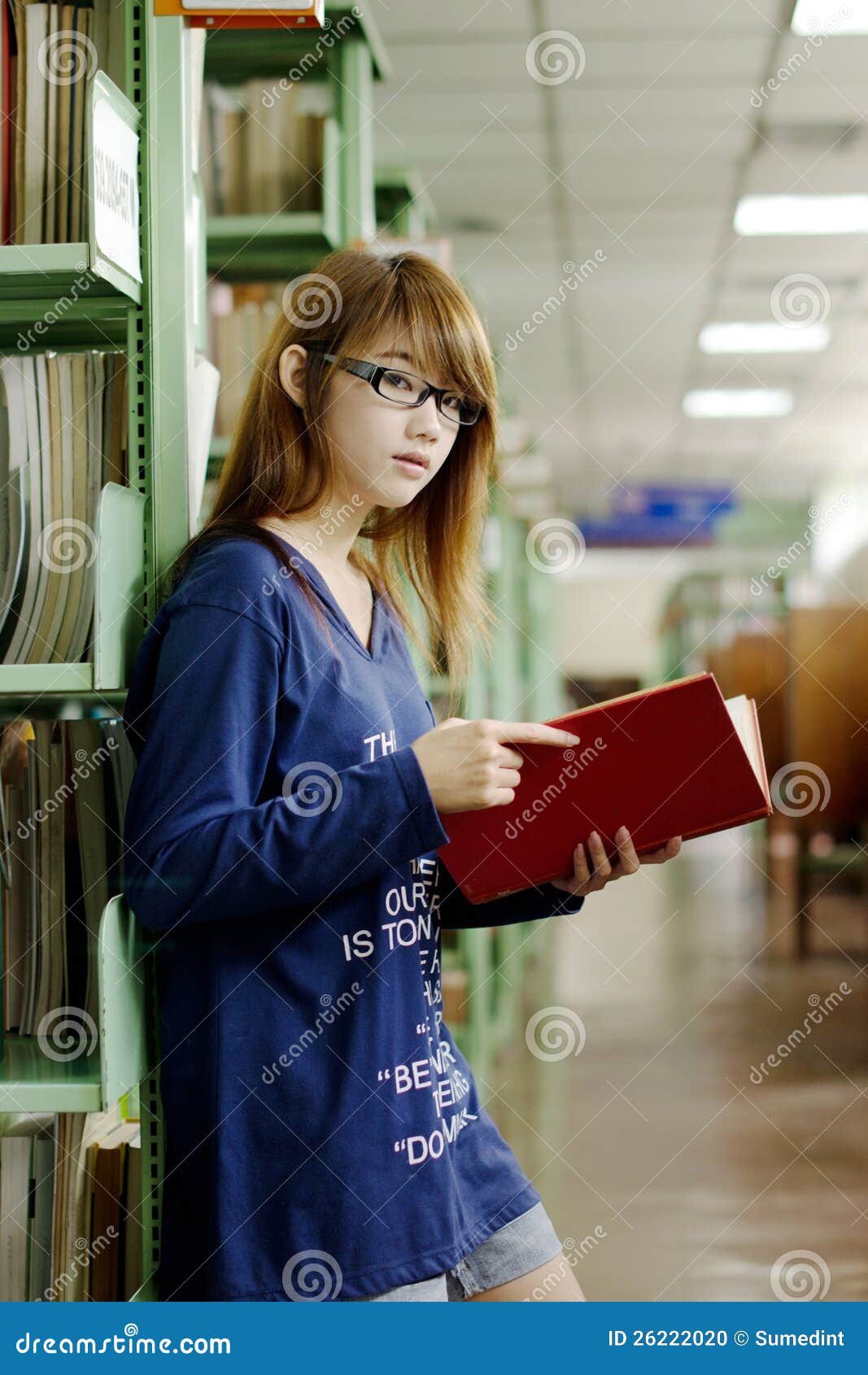 Pretty girl in library stock photo. Image of student - 26222020