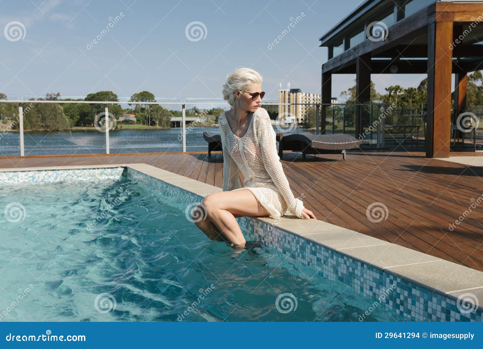 Pretty girl poolside stock photo. Image of river, front - 29641294