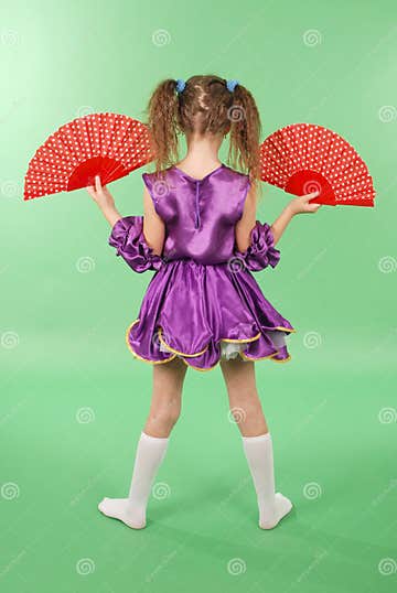 Pretty Girl Posing For The Camera In A Violet Short Dress Stock Image