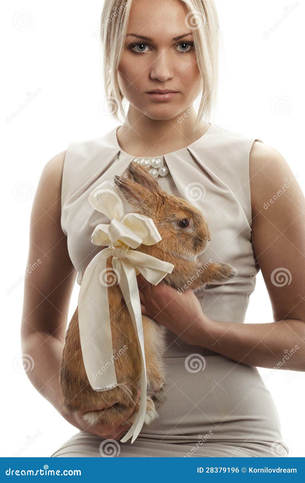 Pretty girl with a rabbit stock photo. Image of beige - 28379196