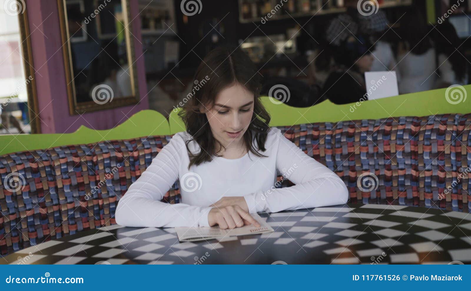 Pretty Girl Reading the Menu To Make an Order. 4K Stock Footage - Video ...