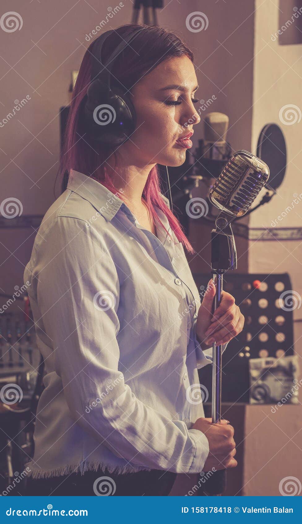 Pretty Girl Singing into Studio Microphone. Stock Photo - Image of face ...