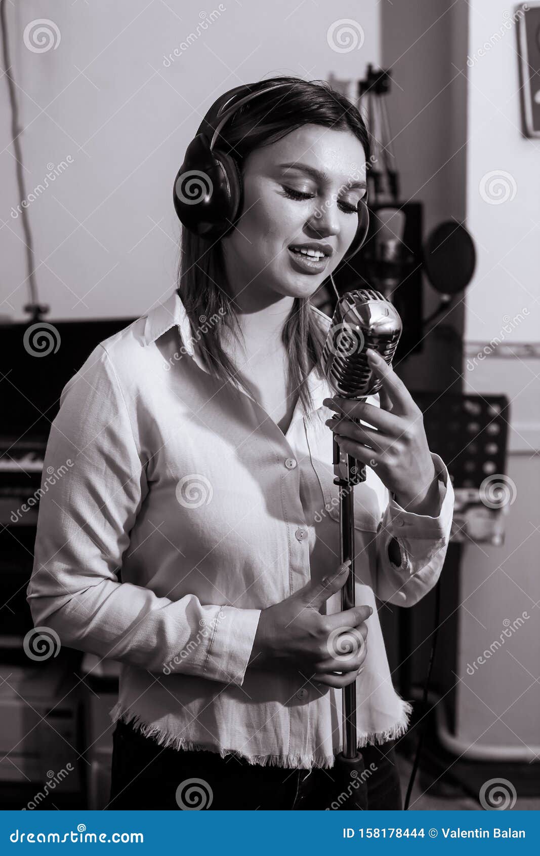 Pretty Girl Singing into Studio Microphone. Stock Photo - Image of ...