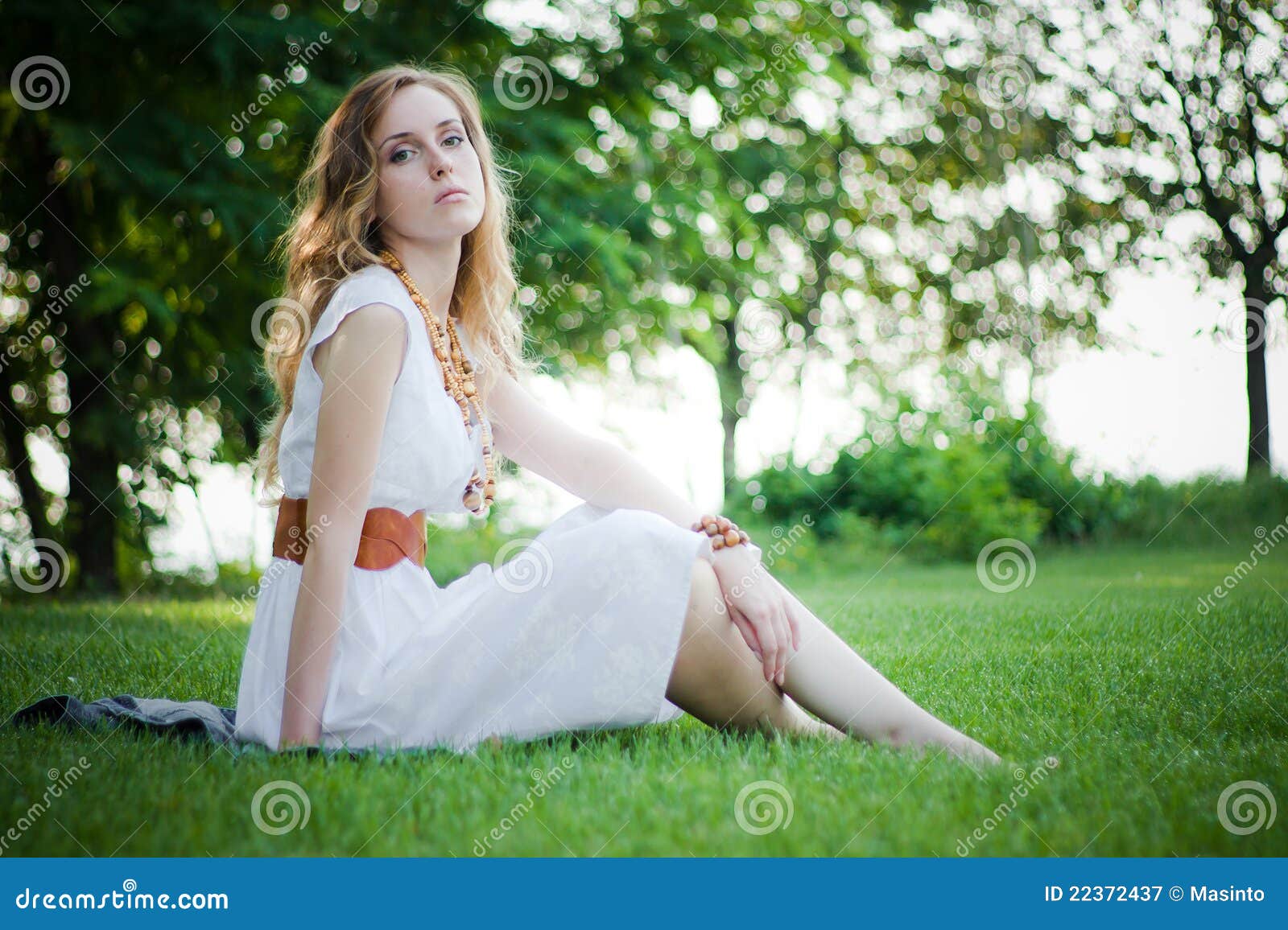 Pretty Girl Sits on the Grass Stock Image - Image of green, face: 22372437