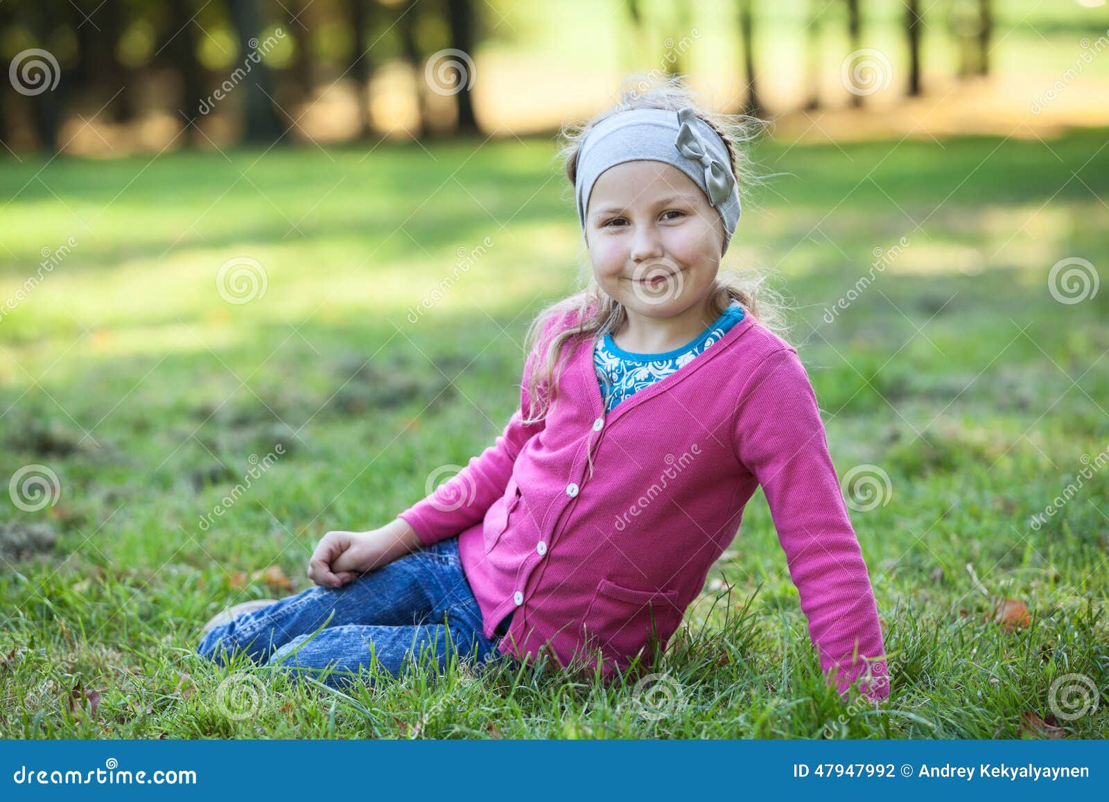 Pretty Girl Sitting on Green Grass Outdoors Stock Photo - Image of ...