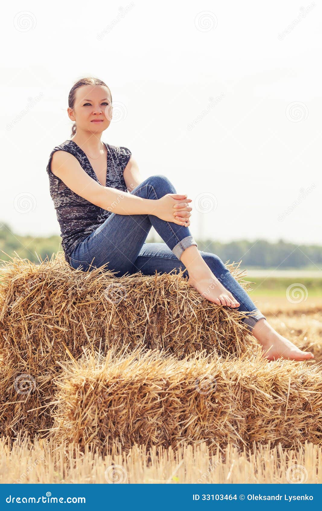 Pretty Girl Sitting on a Haystack Stock Photo - Image of flower ...