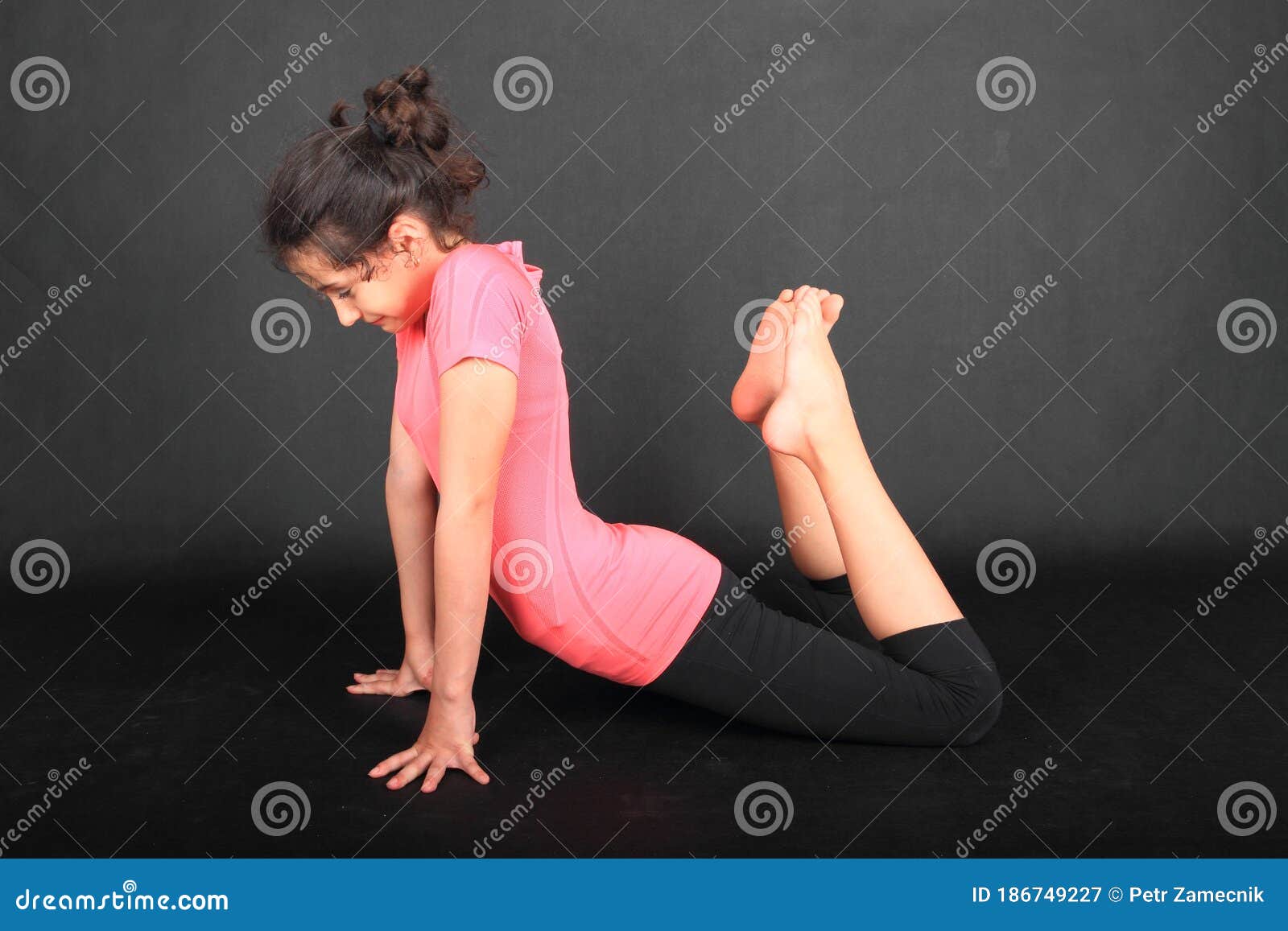 Pretty Girl Trying To Exercise Yoga Advanced Cobra Pose Stock Image