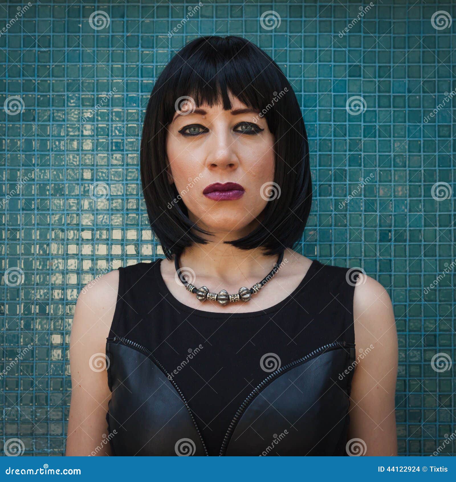 Pretty Goth Girl Posing Against a Blue Wall Stock Photo - Image of ...