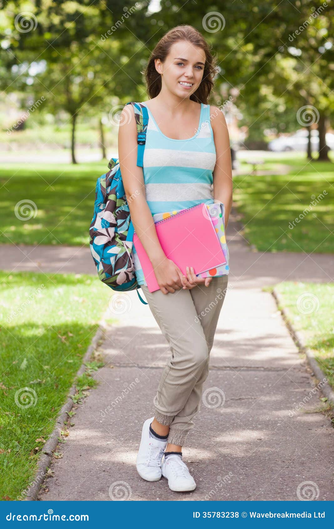 Pretty Happy Student Holding Folder and Notebook Stock Photo - Image of ...