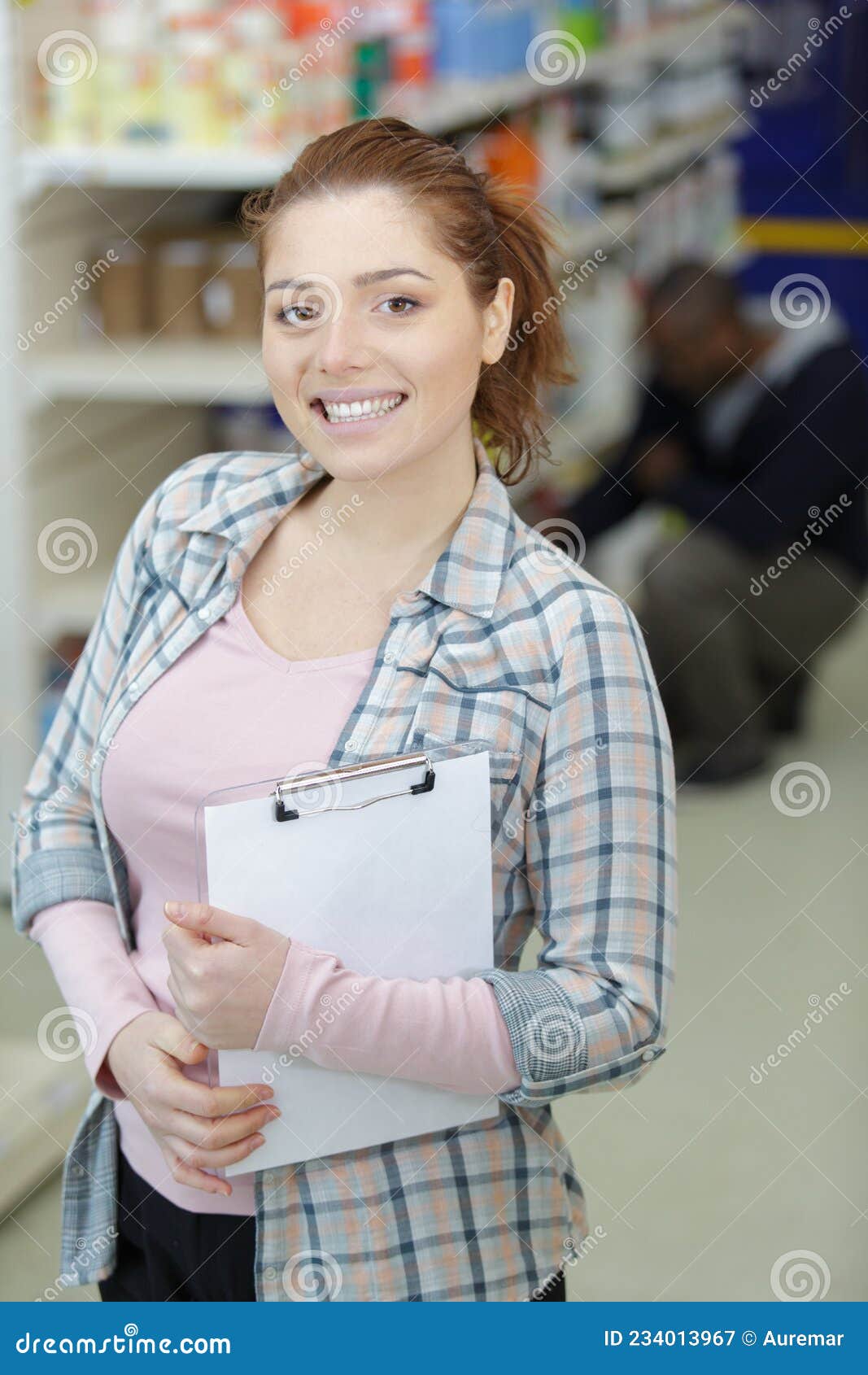 Pretty Hardware Store Worker Holding Clipboard Stock Image - Image of ...