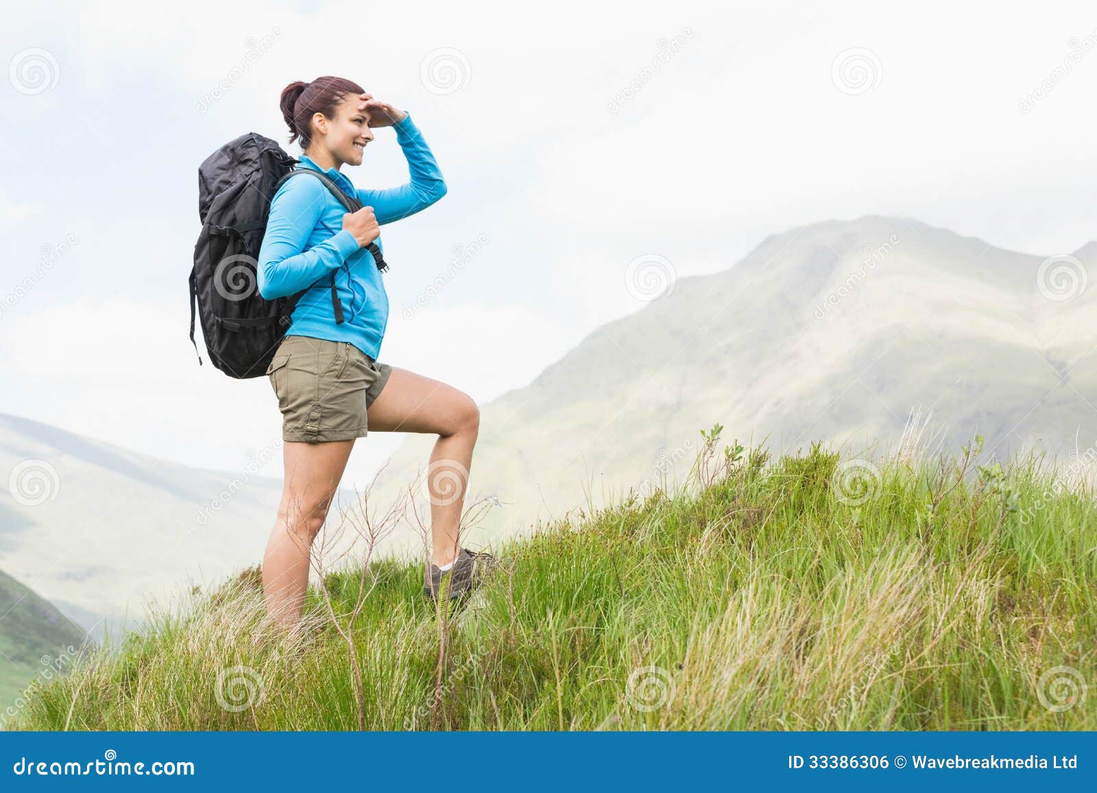 Pretty Hiker with Backpack Walking Uphill Stock Photo - Image of ...
