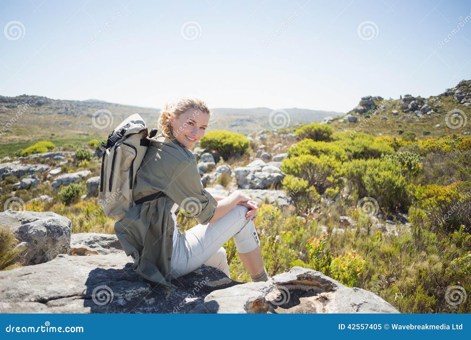 Pretty Hiker Sitting at the Summit Smiling at Camera Stock Image ...