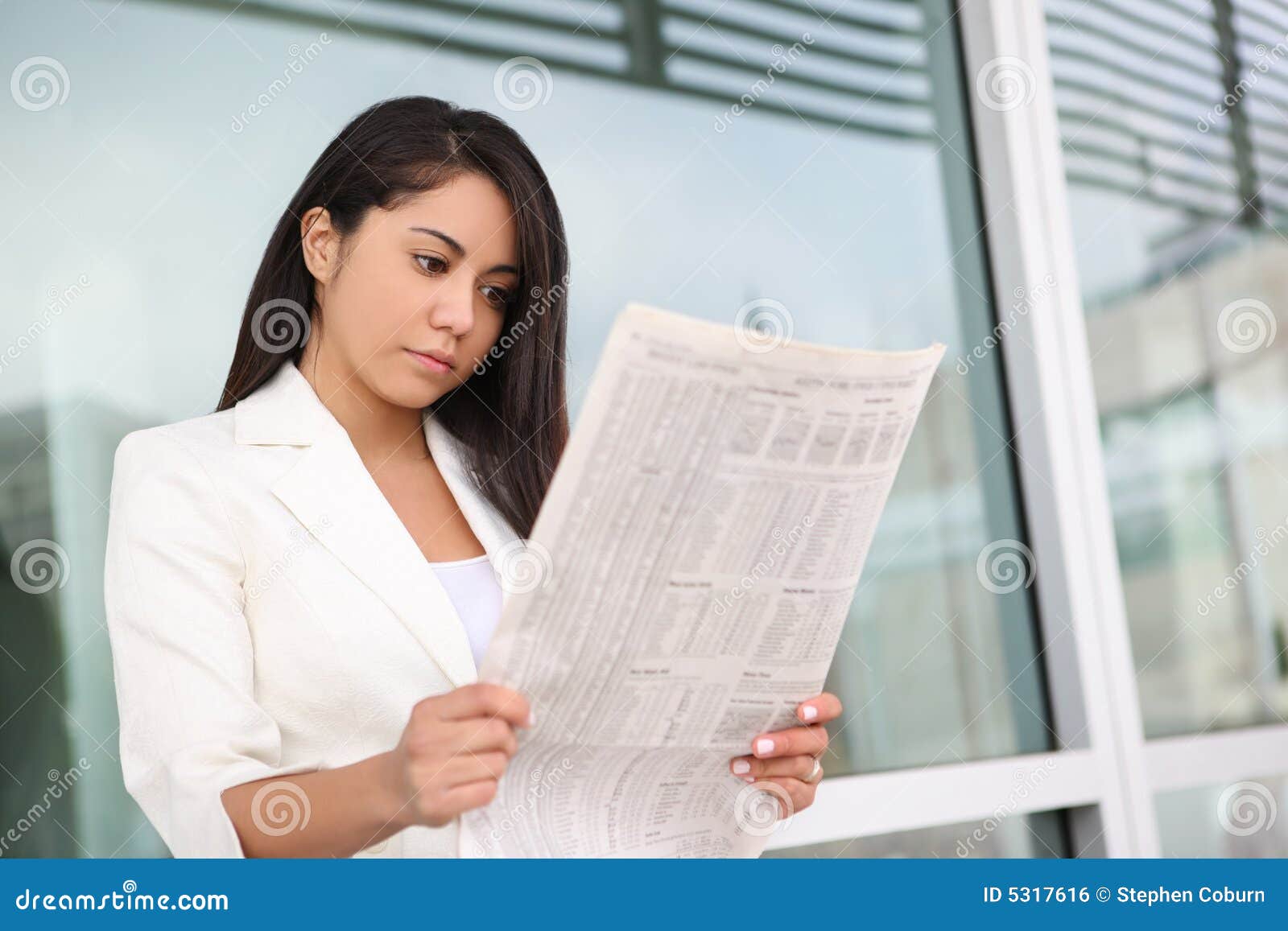 Pretty Hispanic Woman Reading Newspaper Stock Photo - Image of ...