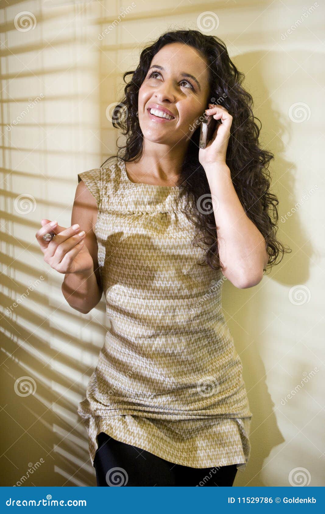 Pretty Hispanic Woman Talking on a Mobile Phone Stock Photo - Image of ...