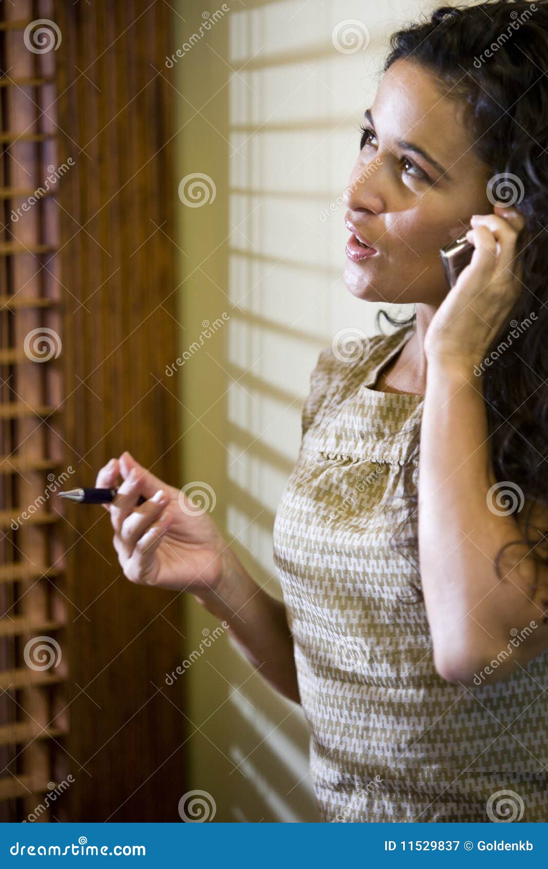 Pretty Hispanic Woman Talking on a Mobile Phone Stock Image - Image of ...