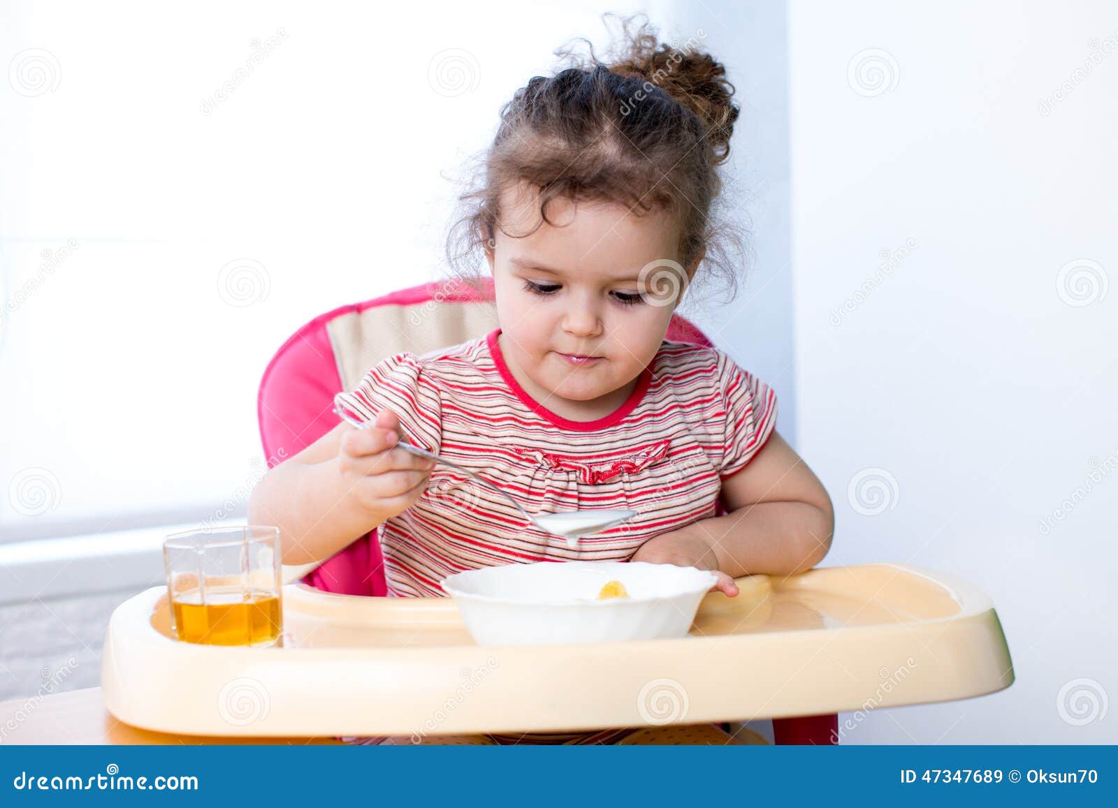 Pretty Kid Eating with Spoon Stock Image - Image of indoors, dinner ...