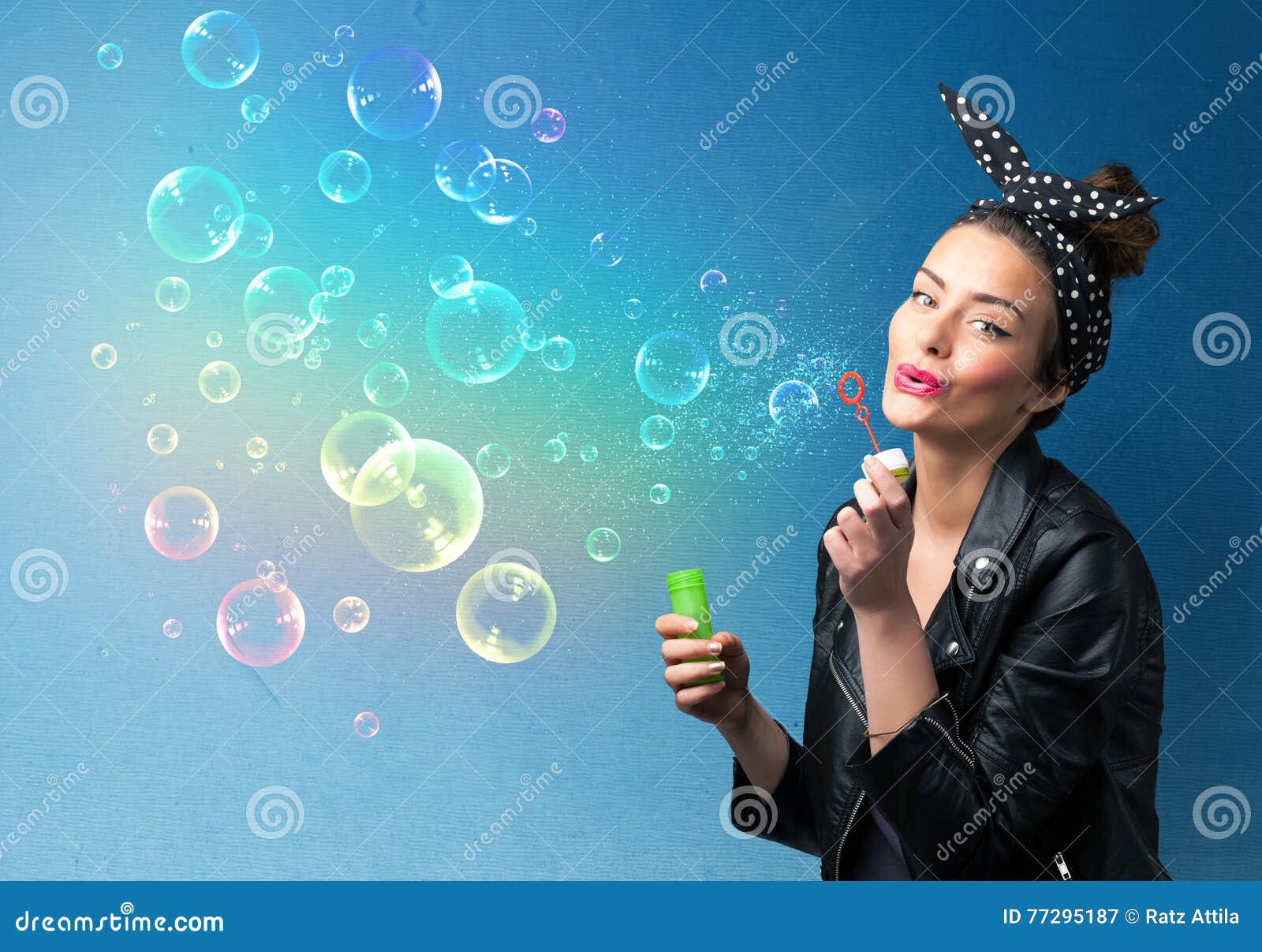 Pretty Lady Blowing Colorful Bubbles on Blue Background Stock Image ...