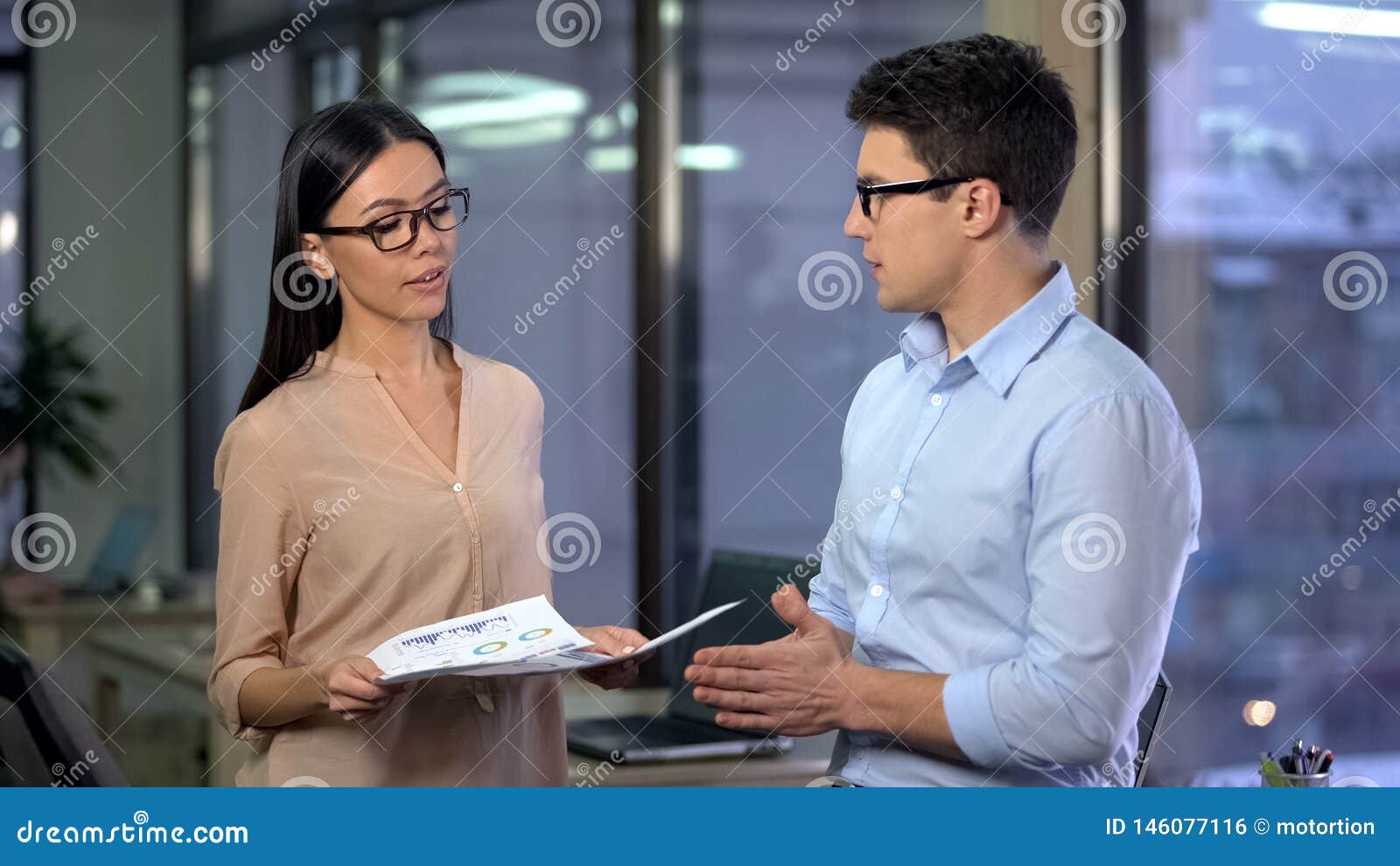 Pretty Lady Boss Checking Work of Young Trainee, Viewing Report of ...