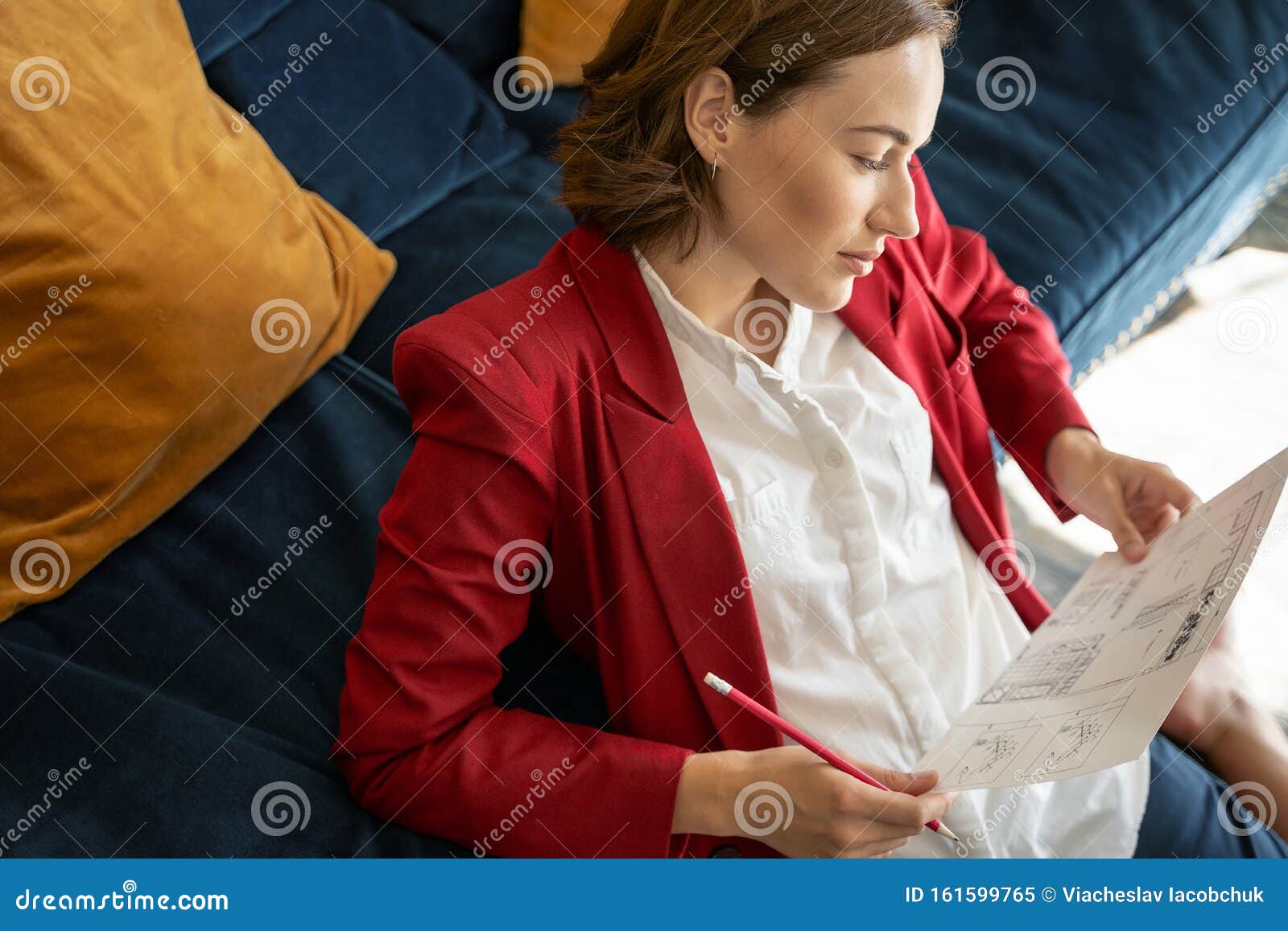 Pretty Lady Looking at a Floor Plan Stock Image - Image of beautiful ...