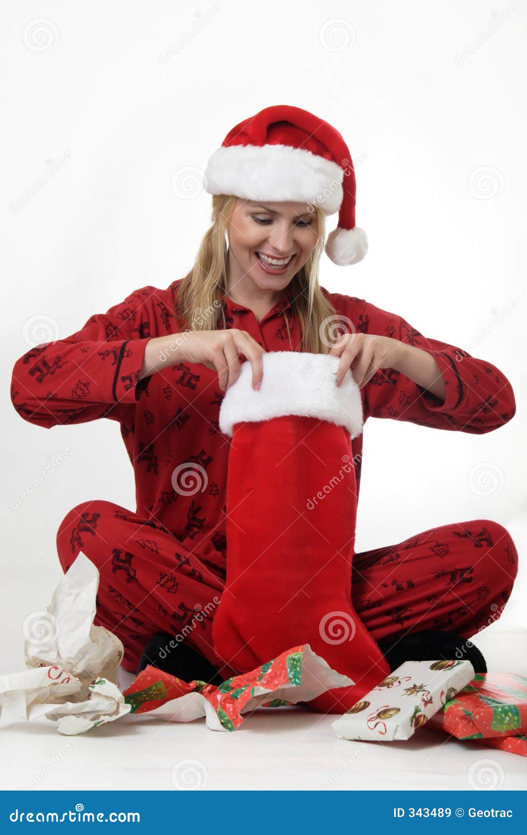 Pretty Lady in Santa Hat Looking Inside Her Stocking Stock Image ...