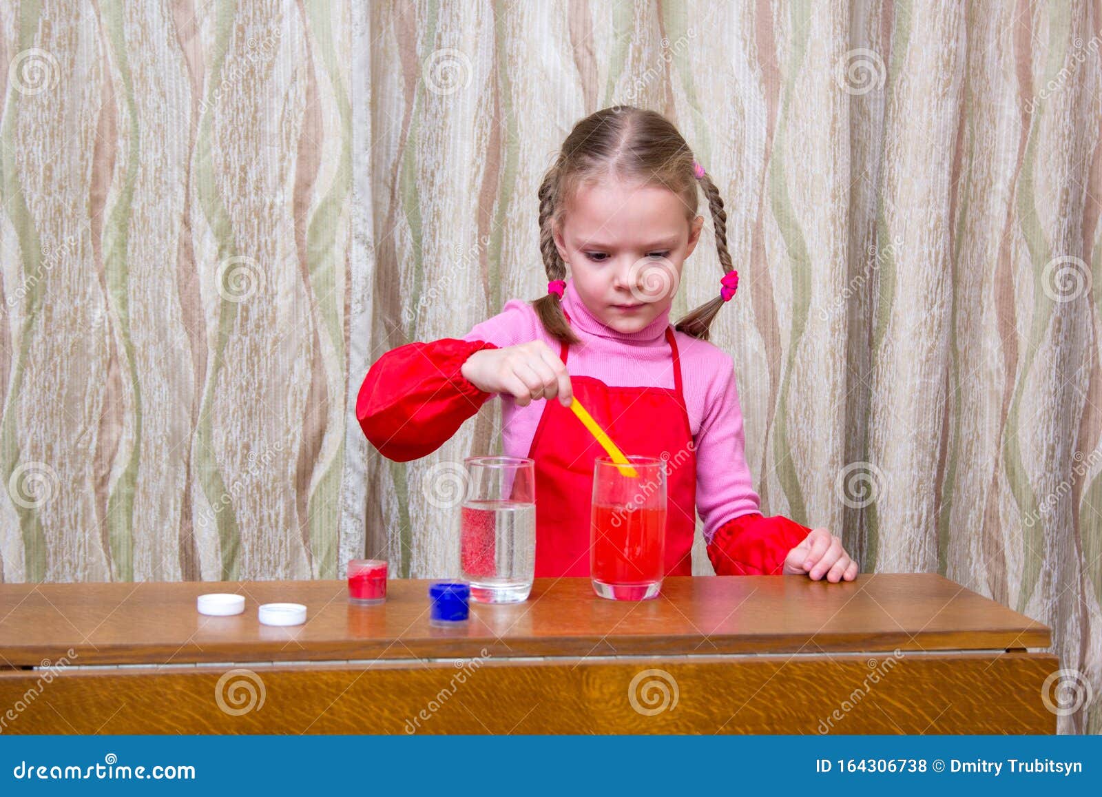 Pretty Little Girl Doing Physical Water Experiments at Home Stock Photo ...