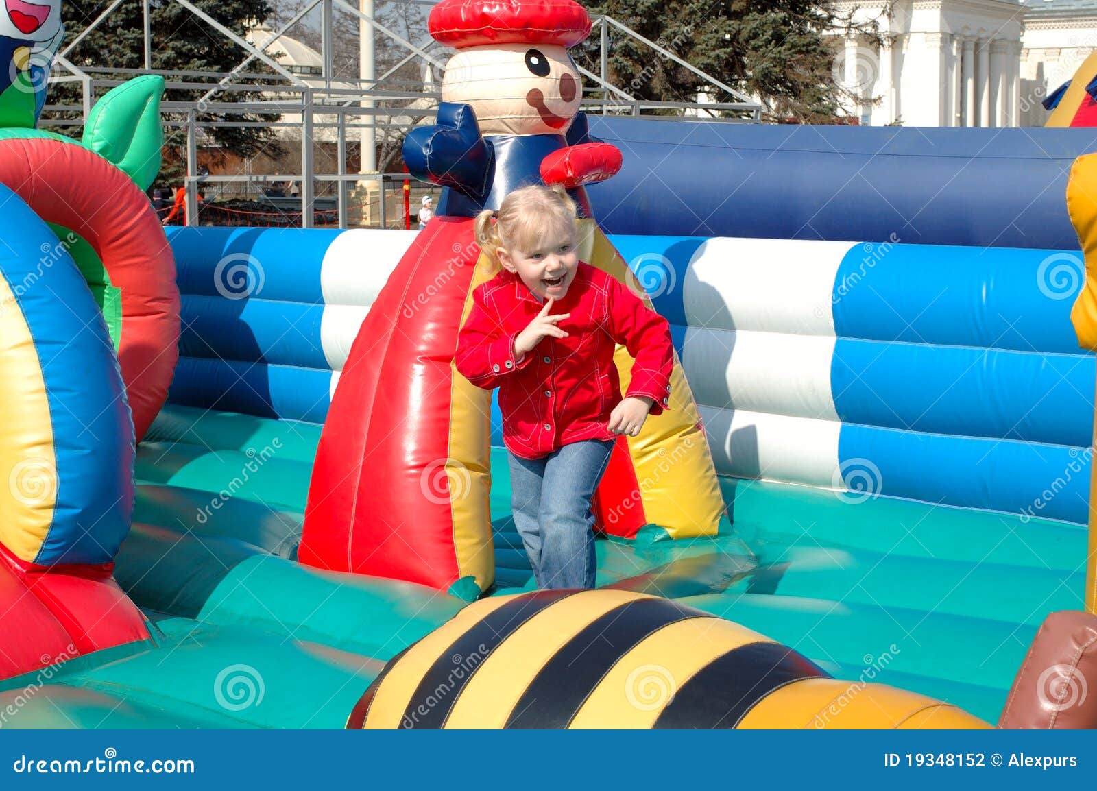 Pretty Little Girl on the Inflatable Ride. Stock Photo - Image of play ...