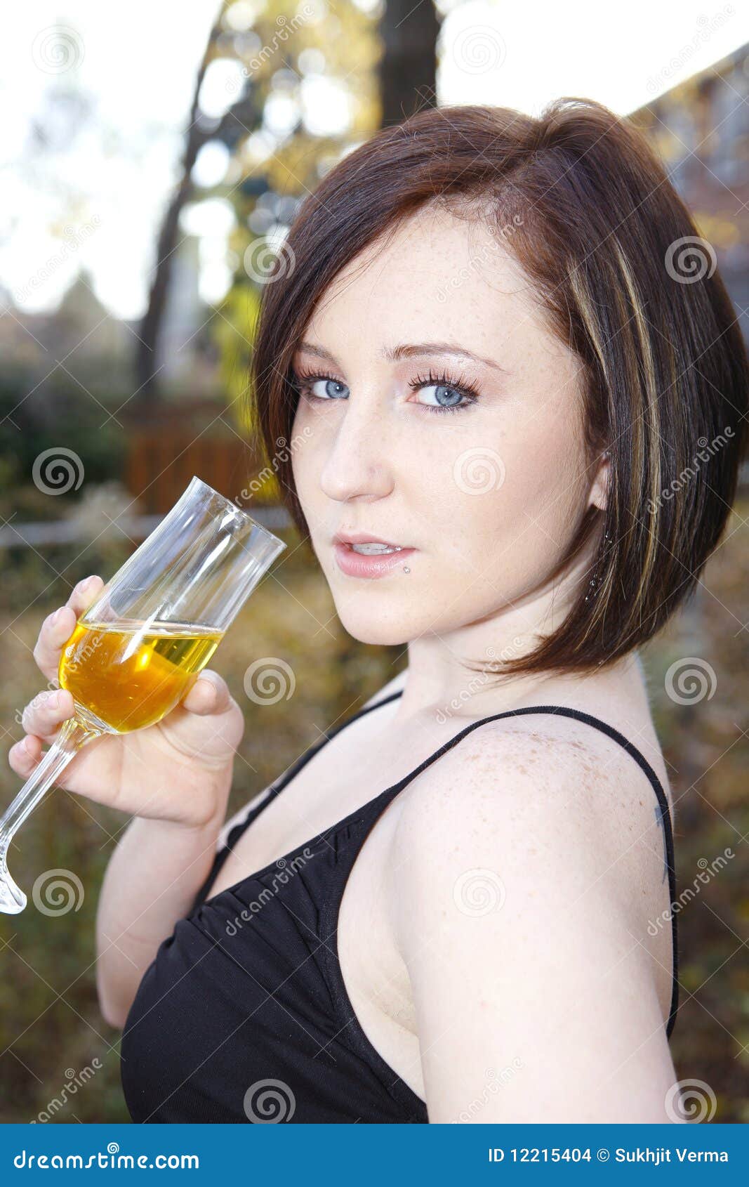 Pretty model drinking wine stock photo. Image of black - 12215404
