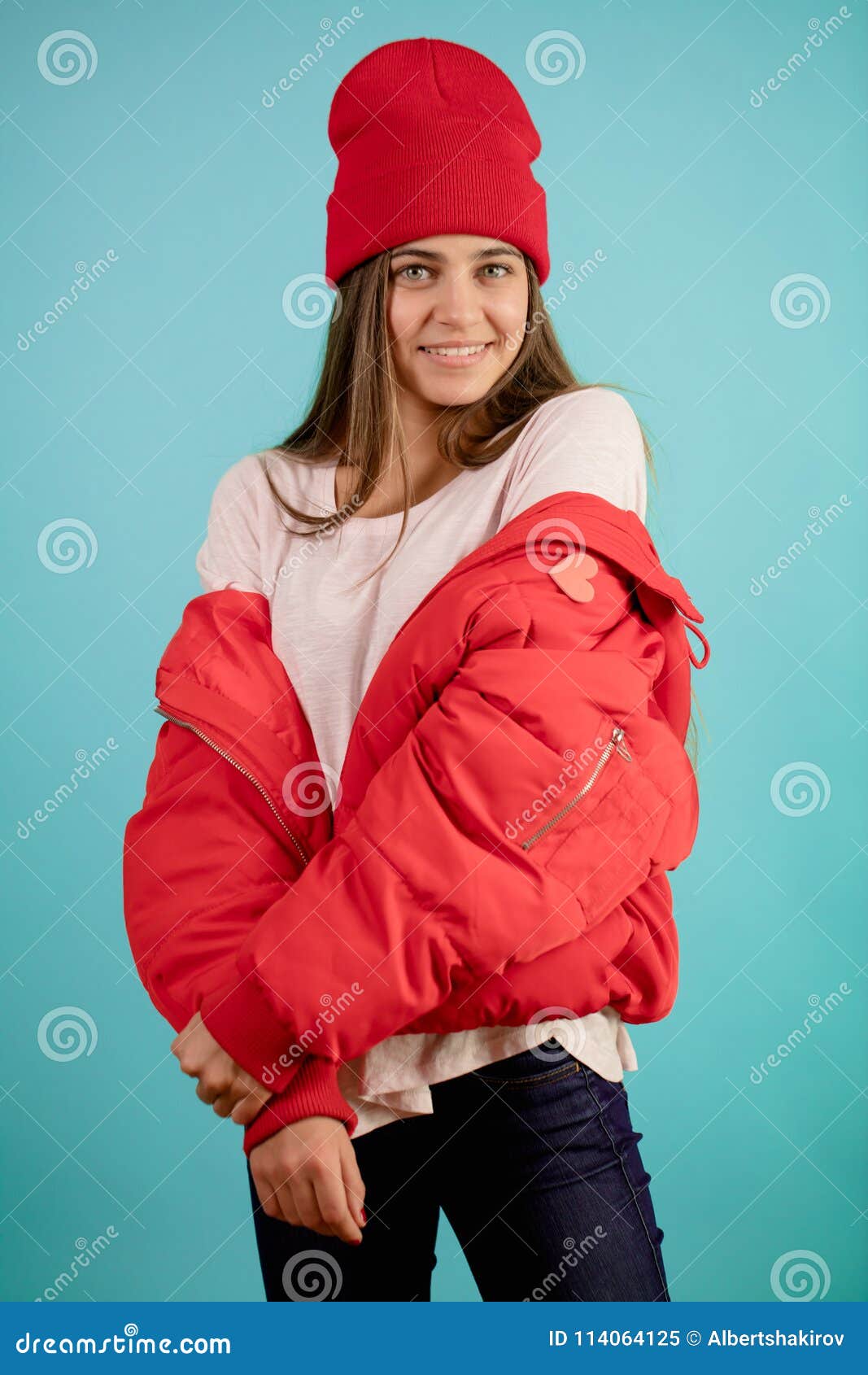 Pretty Model is Wearing Red Down-padded Coat and Read Cap. Ready To ...