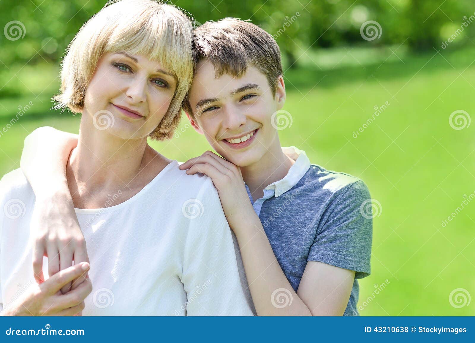 Pretty Mother with Her Charming Son Stock Photo - Image of lawn, casual ...