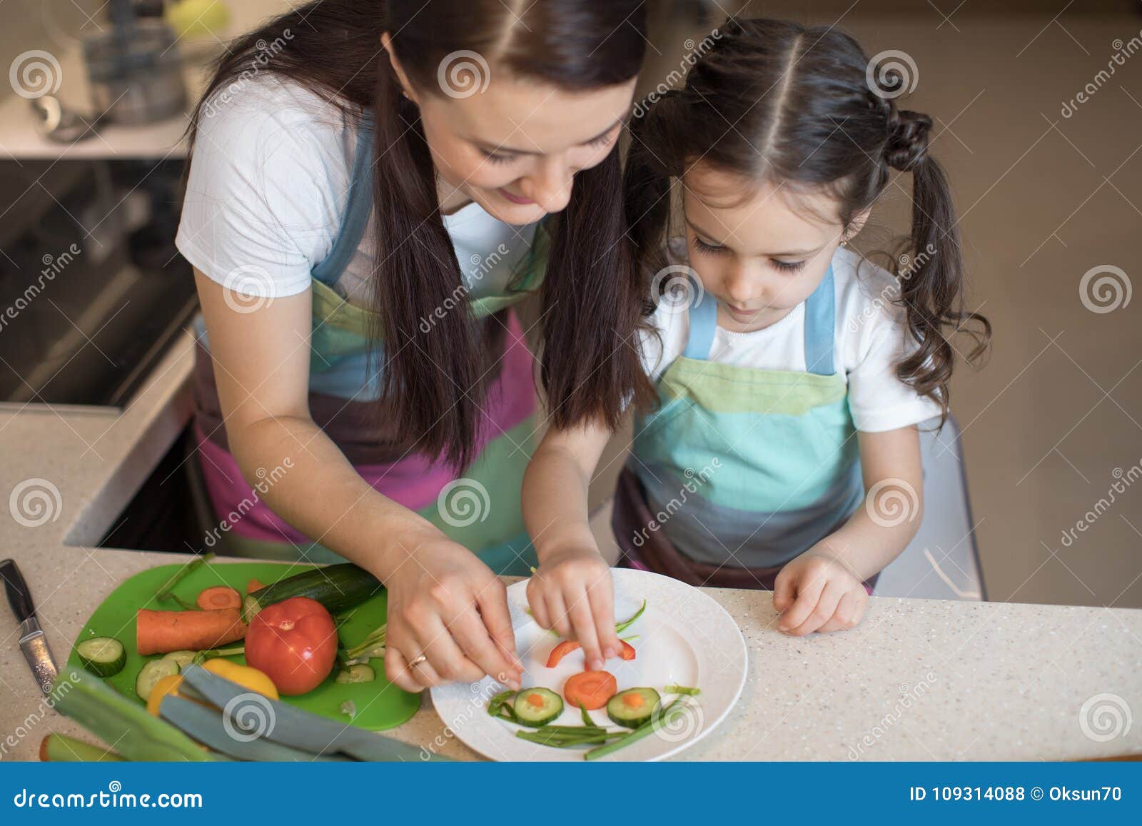 Pretty Mother and Her Kid Making Vegetable Salad Stock Photo - Image of ...