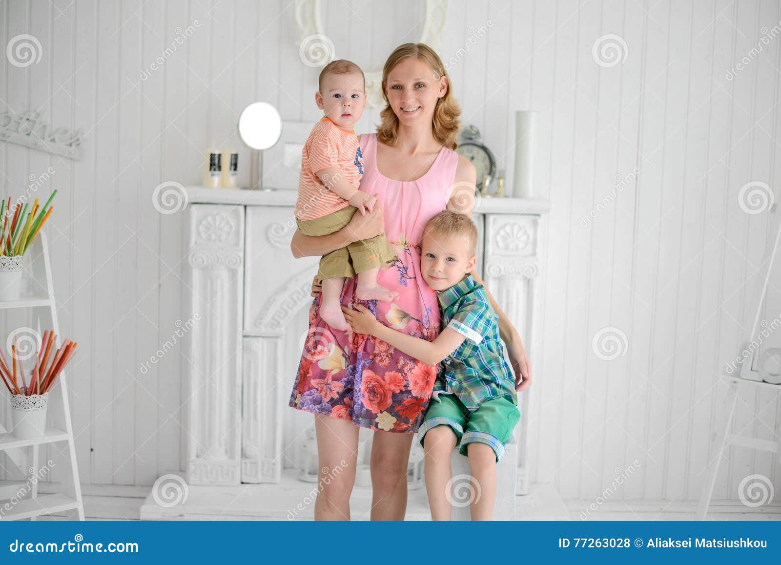 Pretty Mother Standing with Her Children at Home Stock Photo - Image of ...