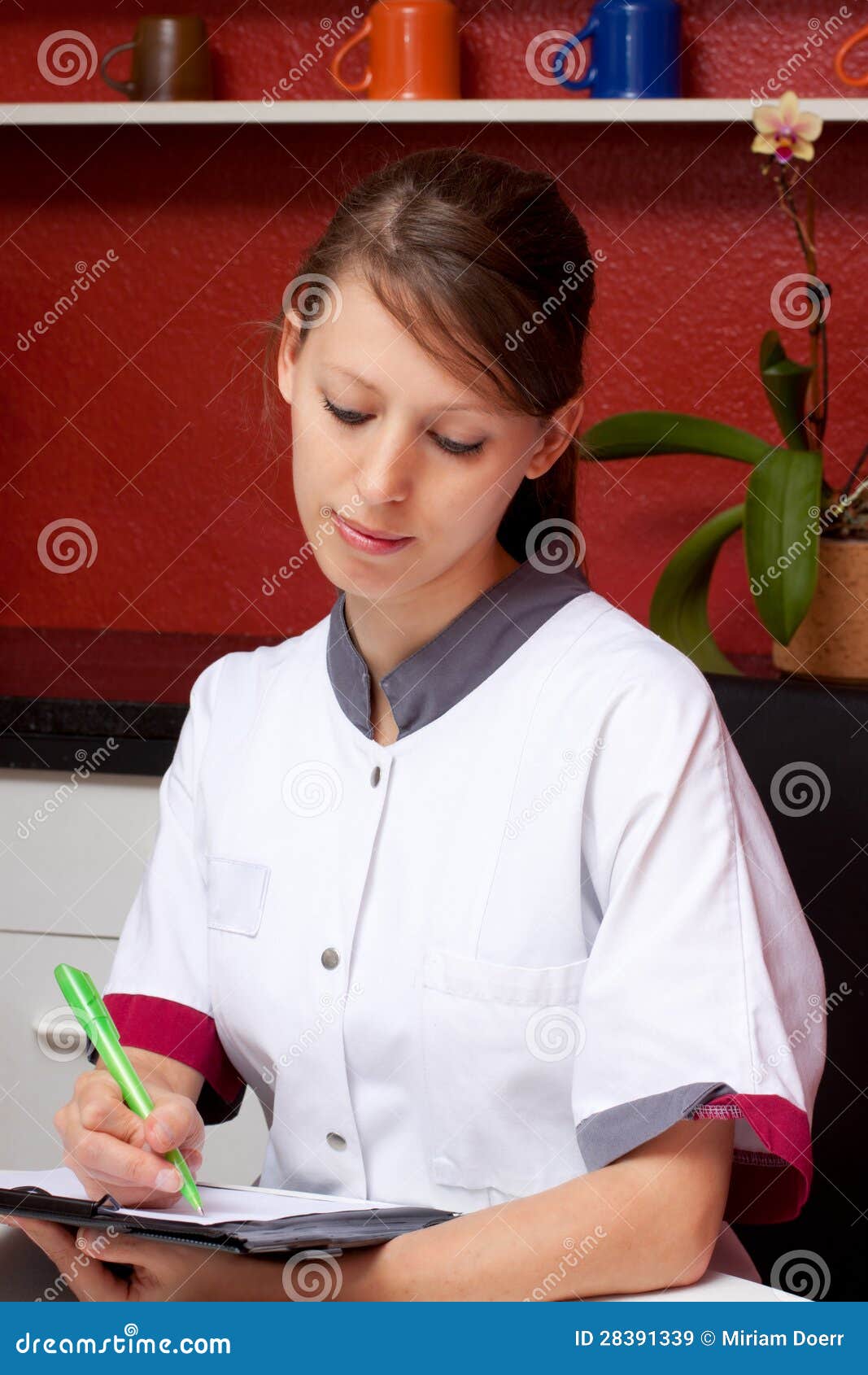 Pretty Nurse Makes Notes To Stock Image - Image of friendly, pretty ...