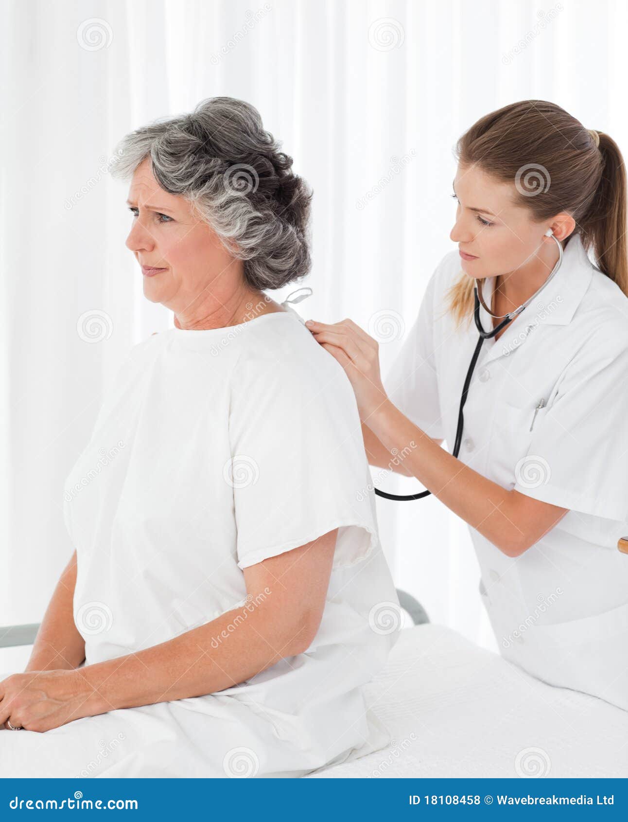 Pretty Nurse Taking the Heartbeat of Her Patient Stock Photo - Image of ...
