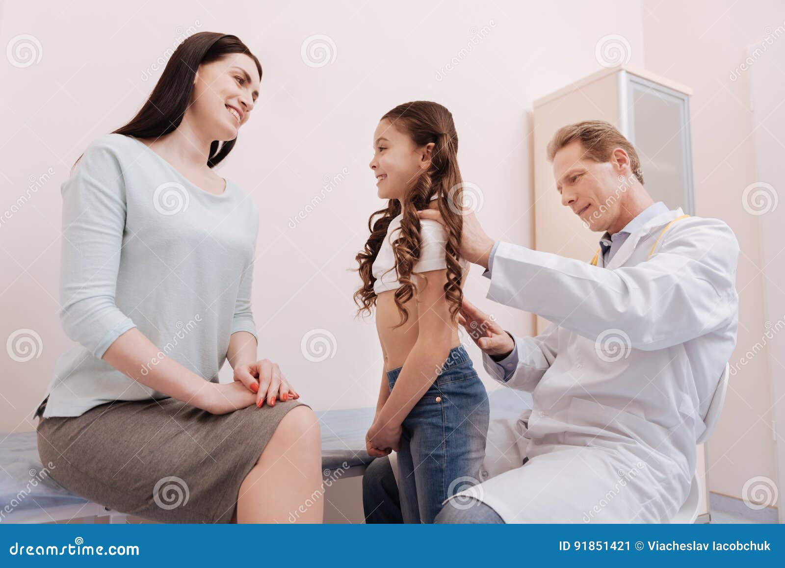 Pretty Obedient Girl Having Her Spine Examined Stock Image Image Of Indoors Clinic 91851421