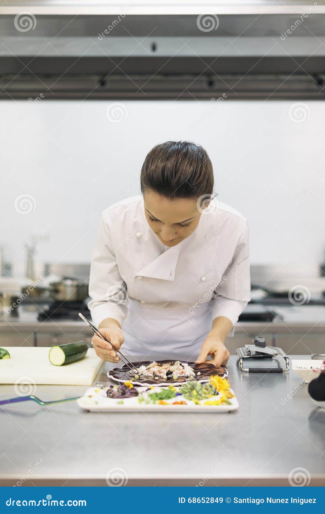 Pretty Professional Chef Cooking in a Kitchen. Stock Image - Image of ...