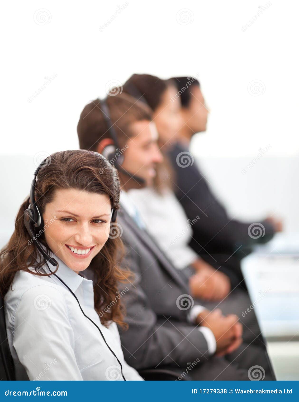 Pretty Representative at Her Desk with Colleagues Stock Photo - Image ...