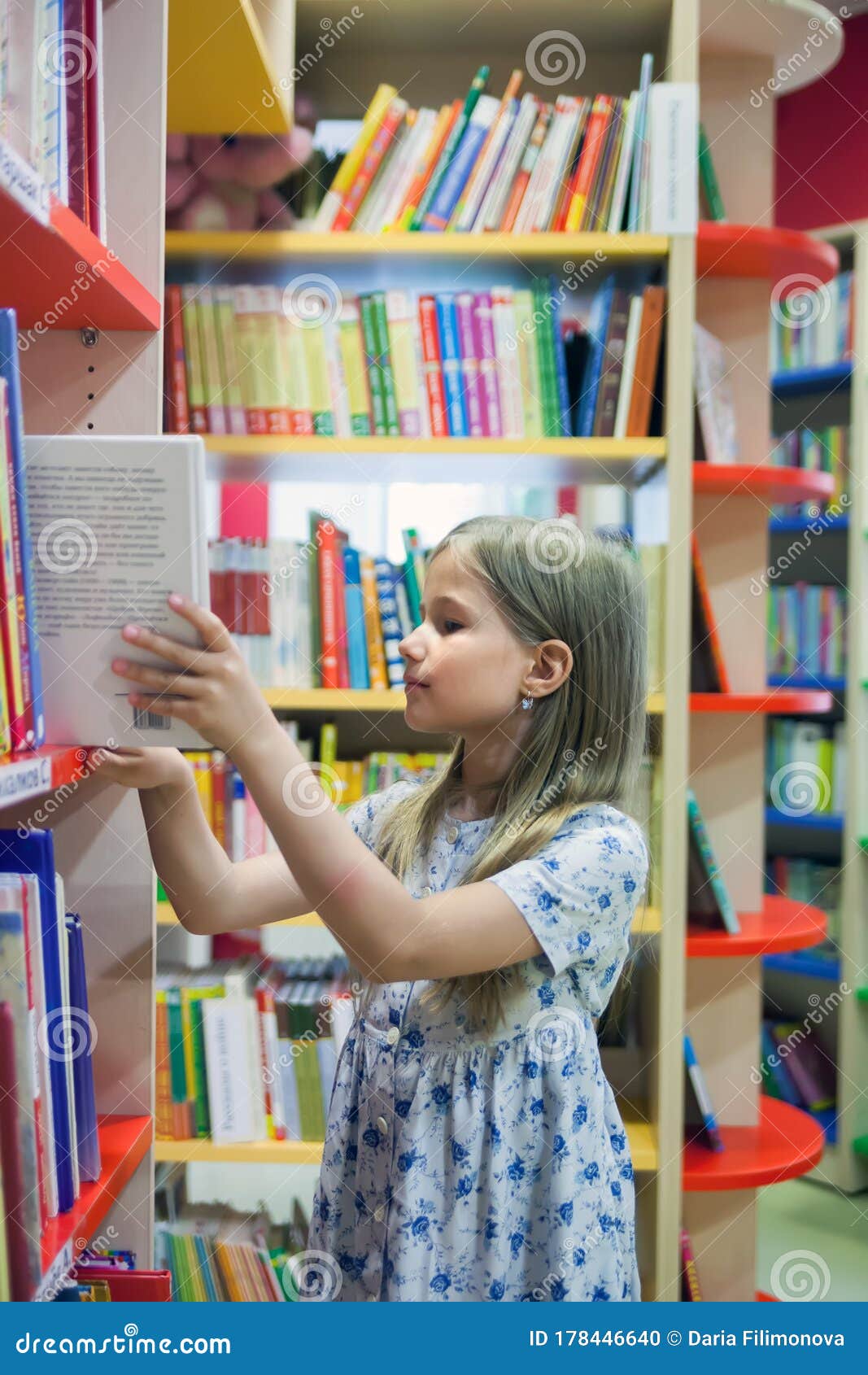 Pretty School Girl in Library Stock Photo - Image of childhood ...