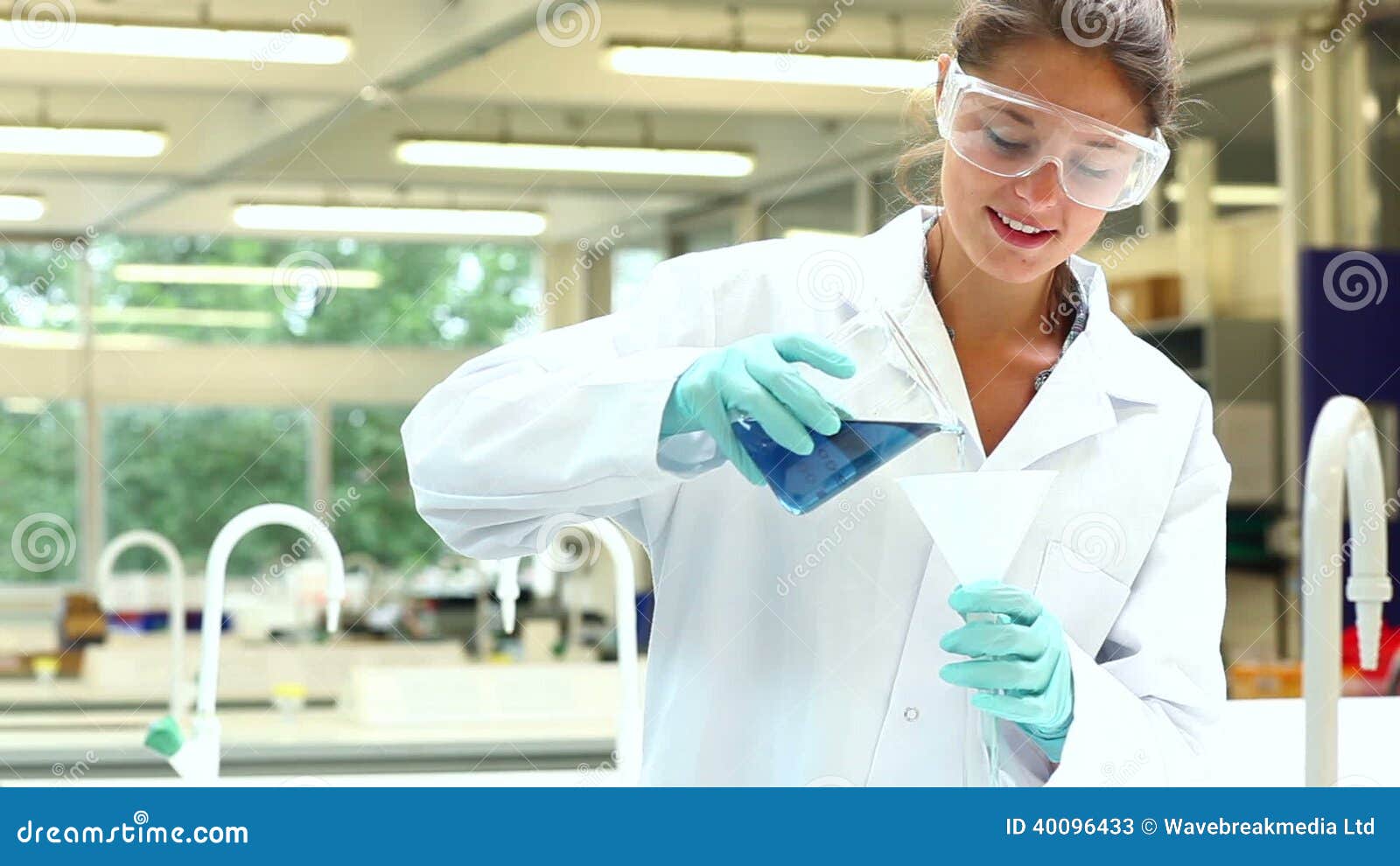 Pretty Science Student Pouring Chemical through Funnel Stock Video ...