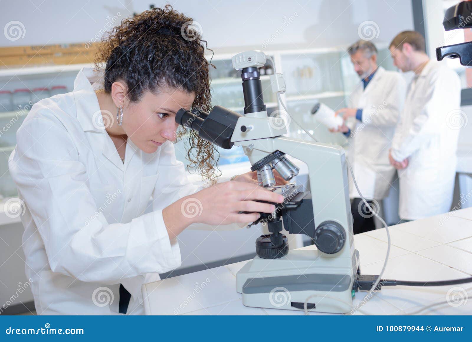 Pretty Science Student Using Microscope at University Stock Photo ...