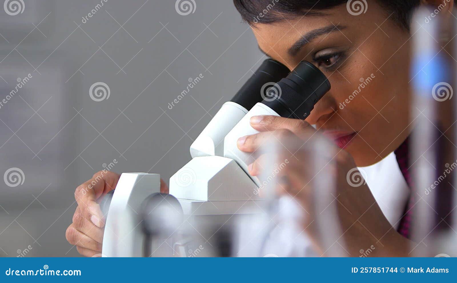 Pretty Scientist Analyzing Substances through Microscope Stock Footage ...