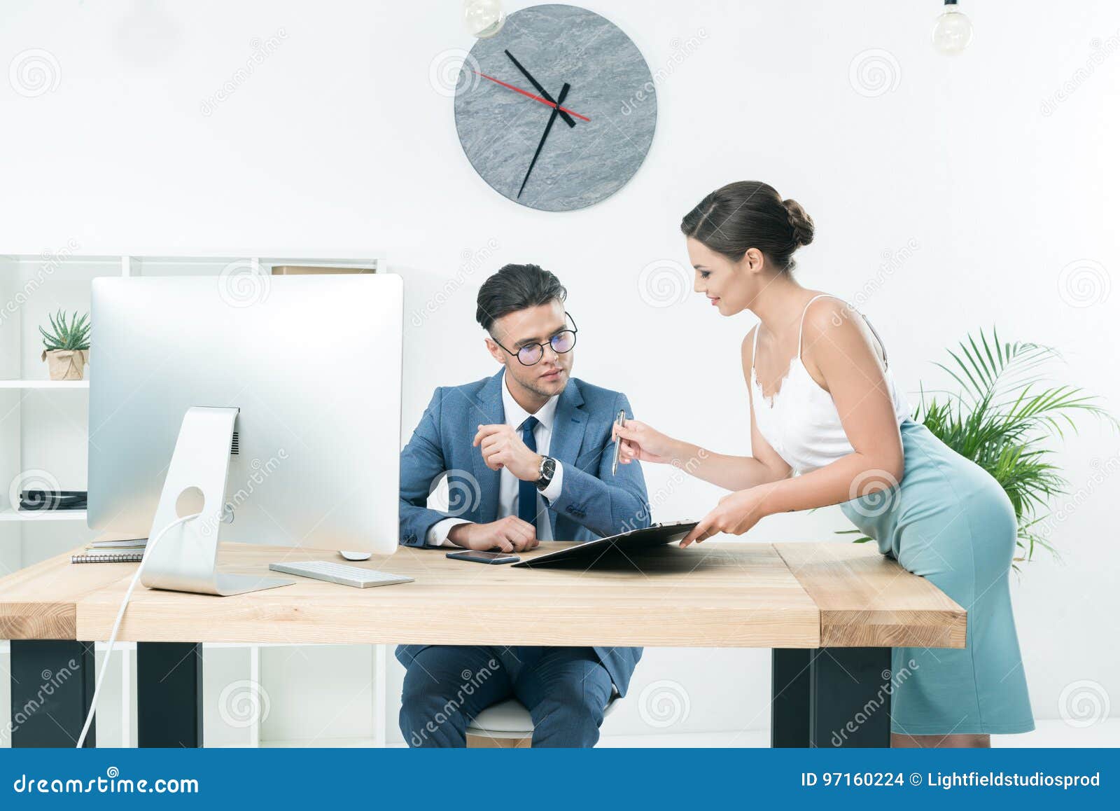 Pretty Secretary Talking To Her Boss at Office Stock Photo - Image of ...