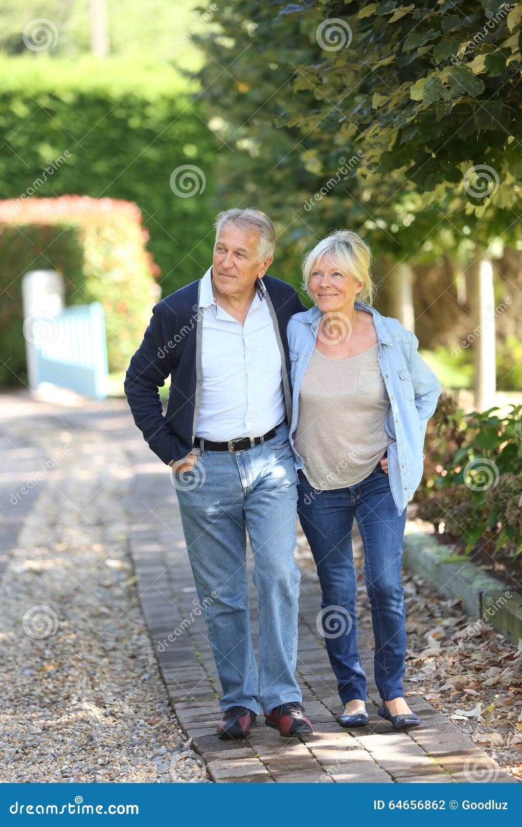 Pretty Senior Couple Taking a Walk Stock Photo - Image of embracing ...