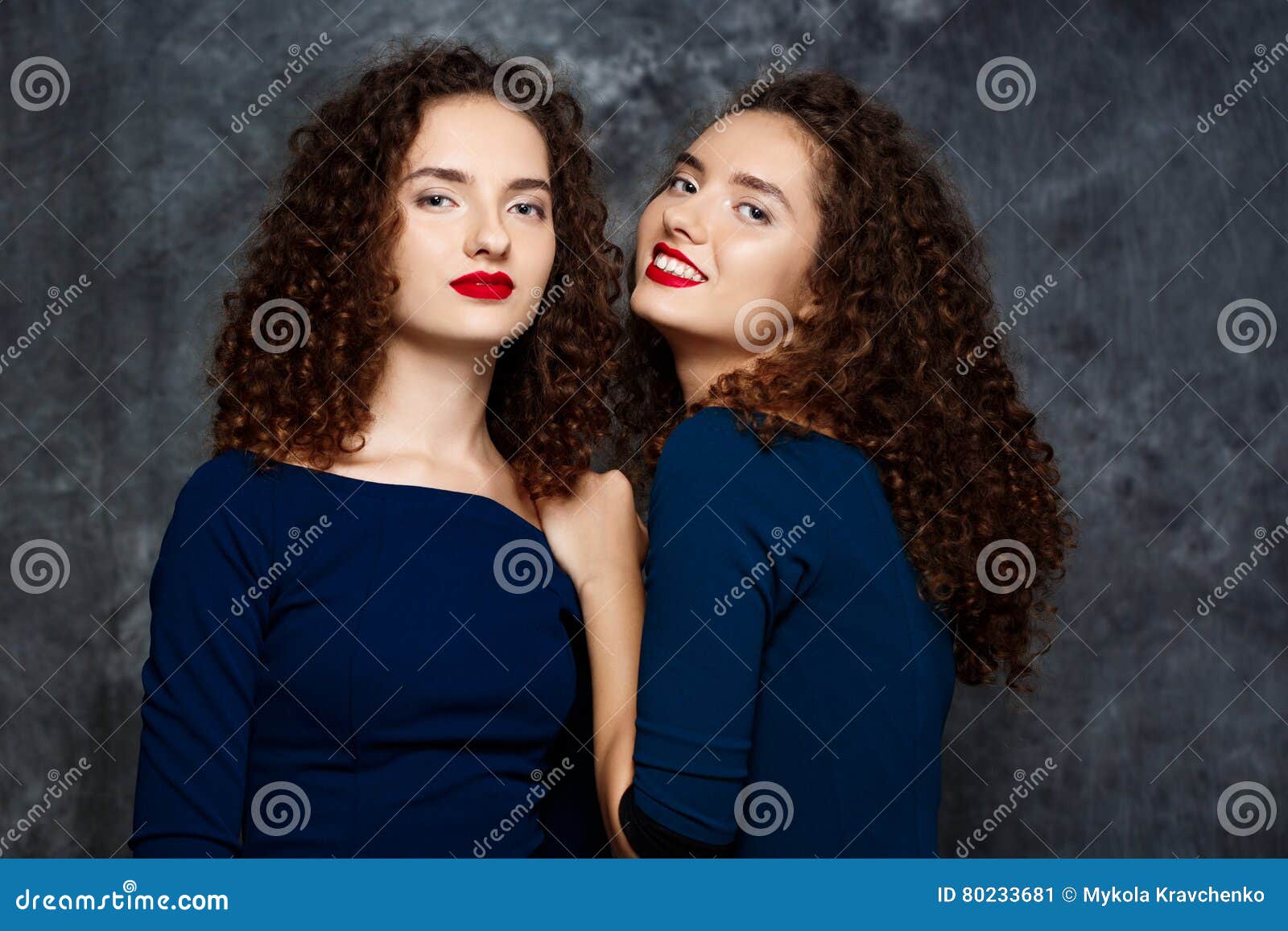 Pretty Sisters Twins Smiling Looking At Camera Over Grey Background ...